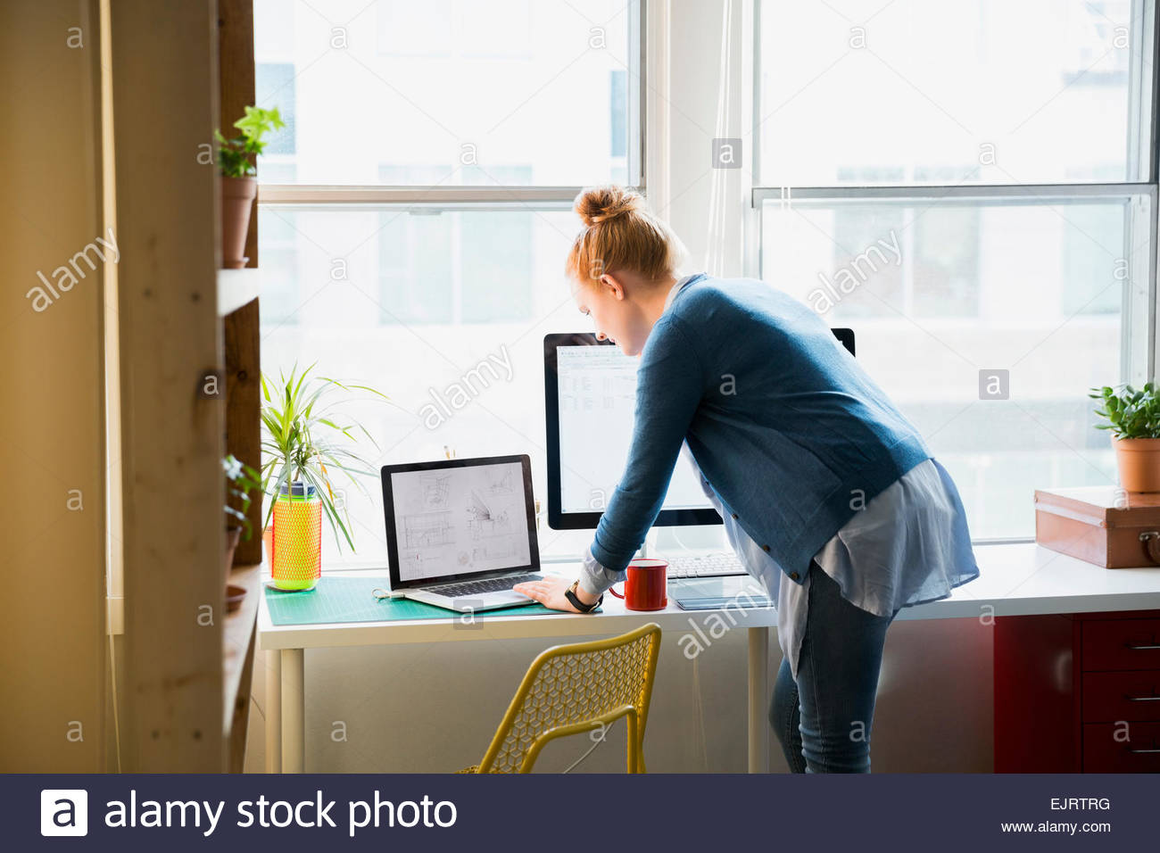Leaning over to get the shot hi-res stock photography and images - Alamy