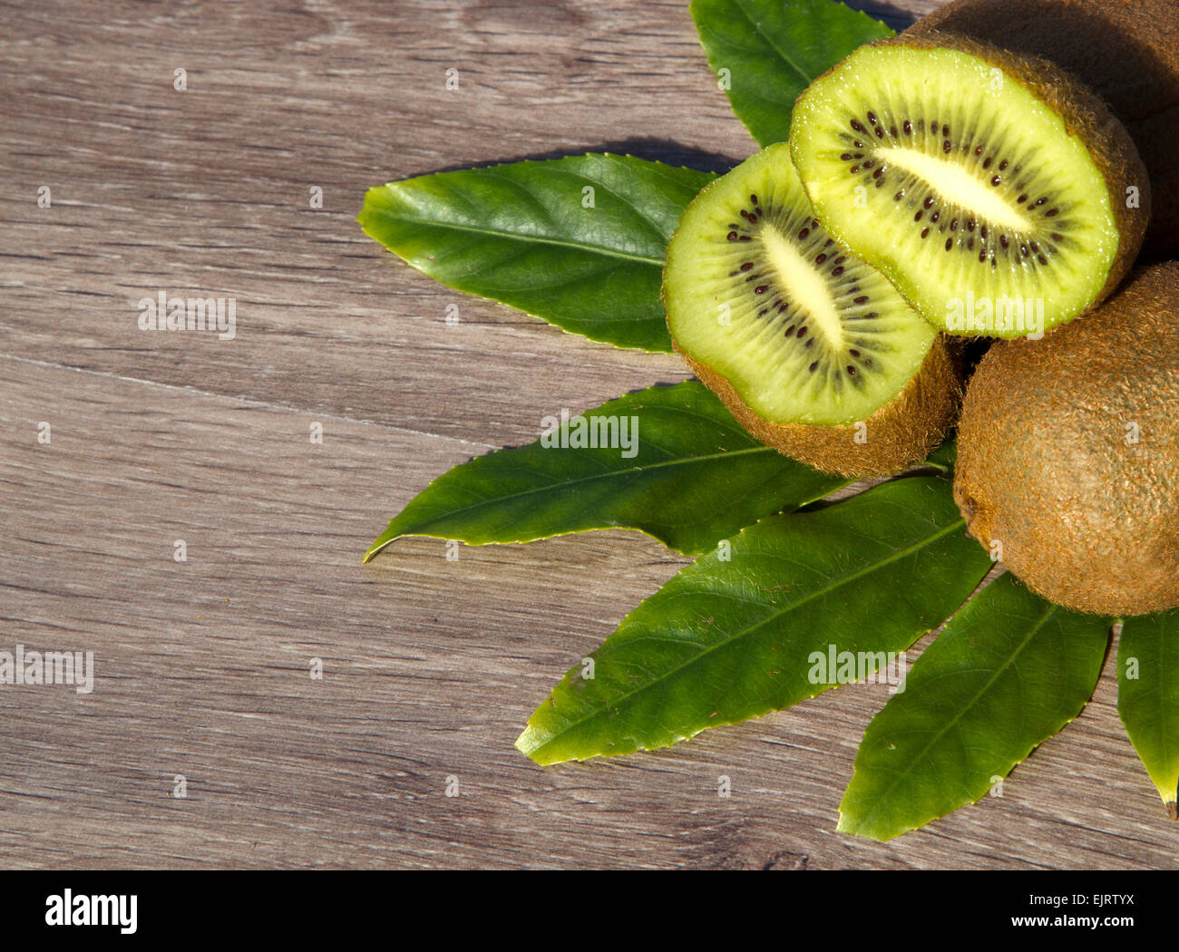 photo of fresh kiwi on the table Stock Photo - Alamy
