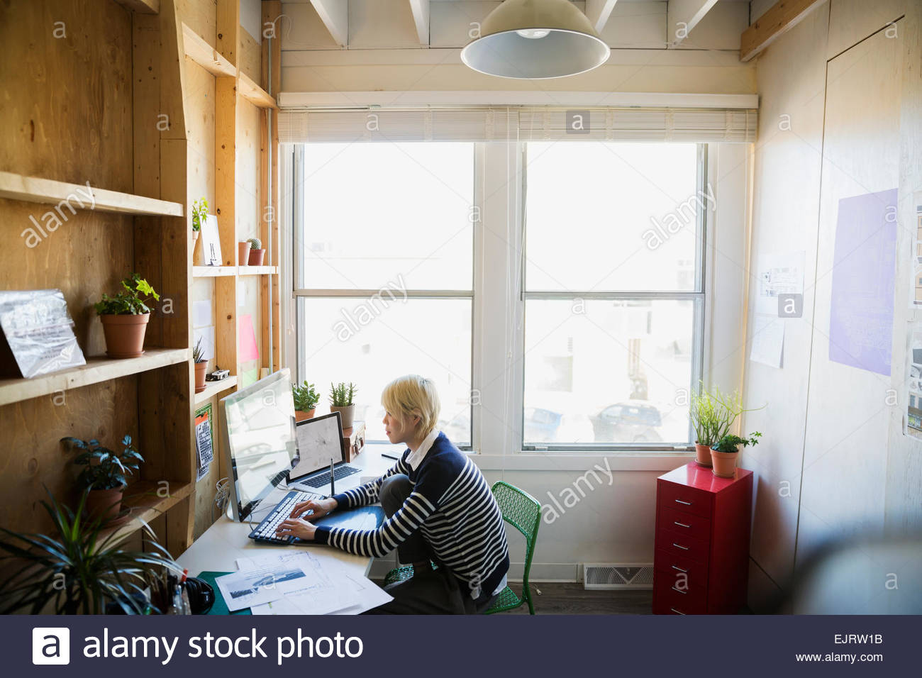 Designer working at computer in office Stock Photo - Alamy