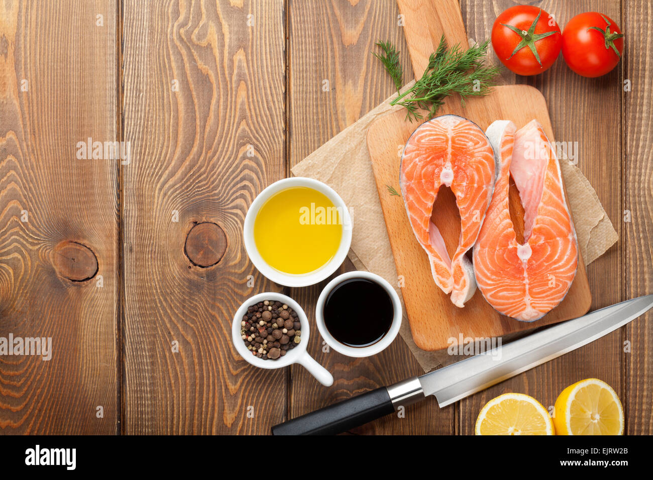 Salmon and spices on wooden table. Top view with copy space Stock Photo ...