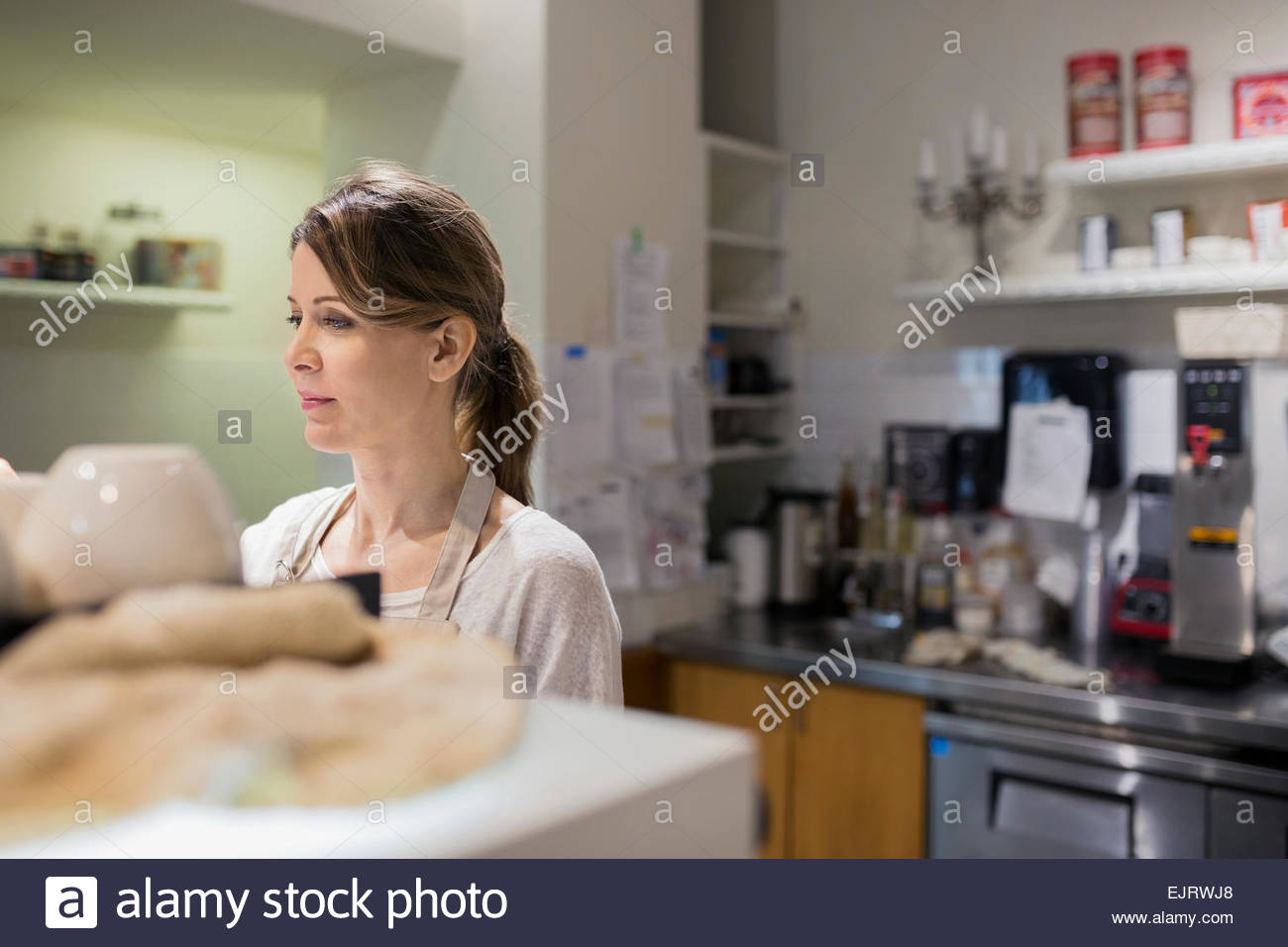 Barista working in cafe Stock Photo - Alamy