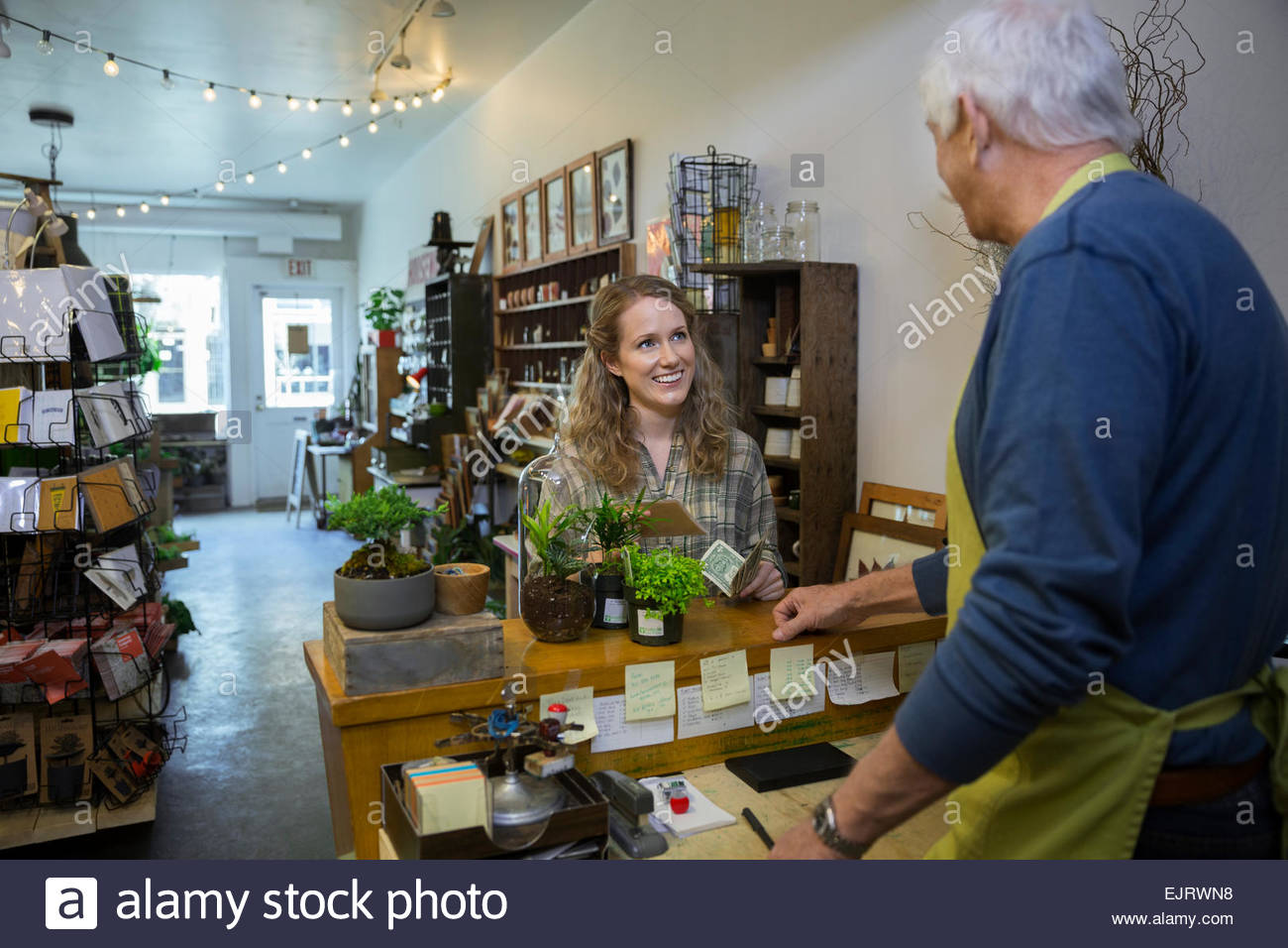 Woman shop counter hi-res stock photography and images - Alamy