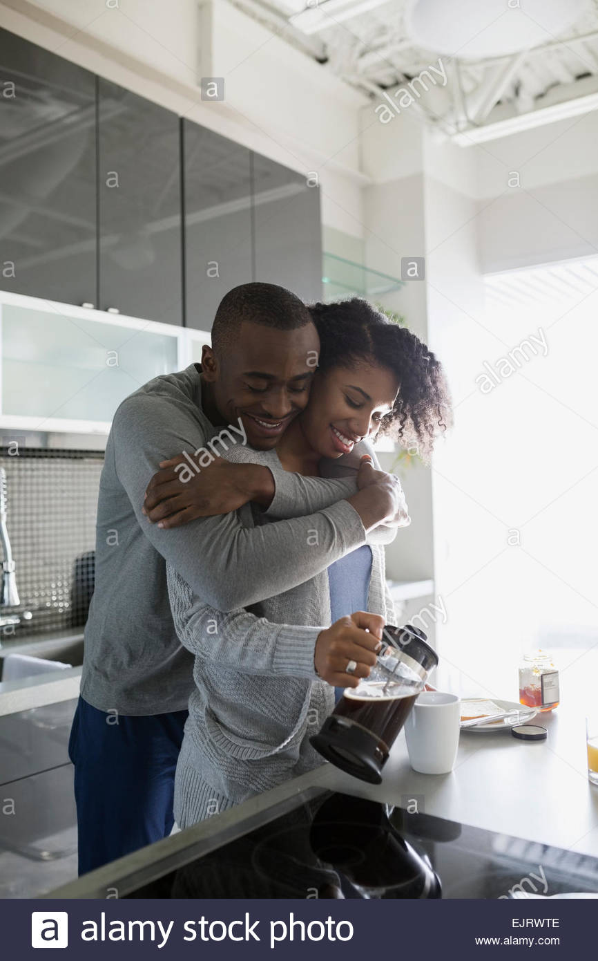 smiling couple hugging Stock Photo - Alamy