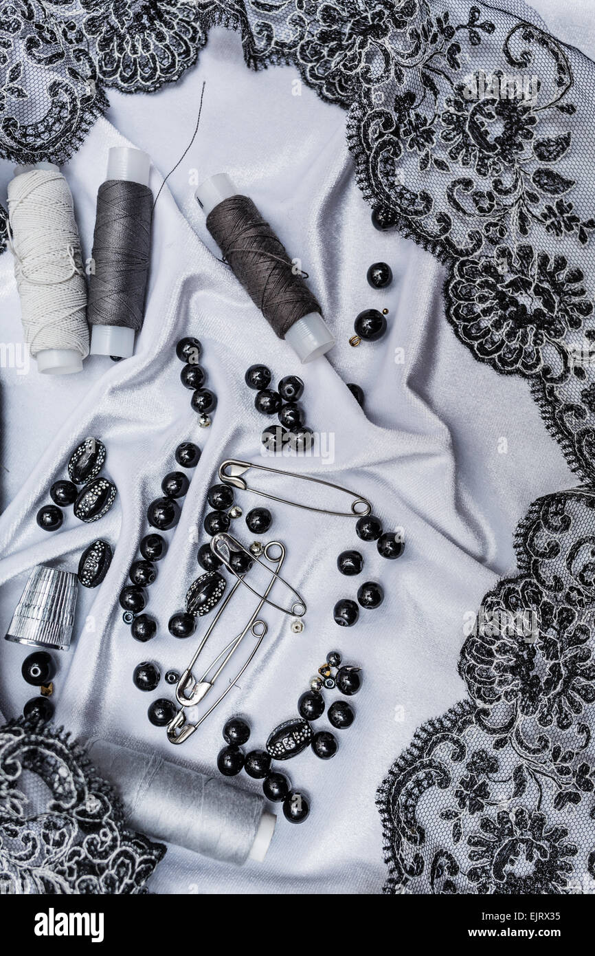 Handicrafts background. Thread, pins, thimbles Stock Photo - Alamy