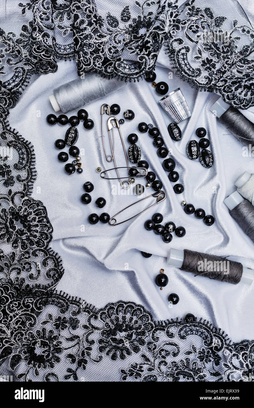 Handicrafts background. Thread, pins, thimbles Stock Photo - Alamy