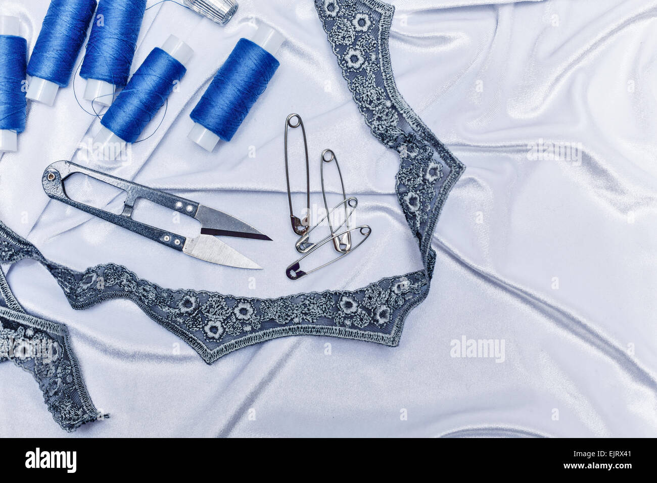 Scissors, thread, pins, silk fabric. Handicrafts abstraction Stock ...