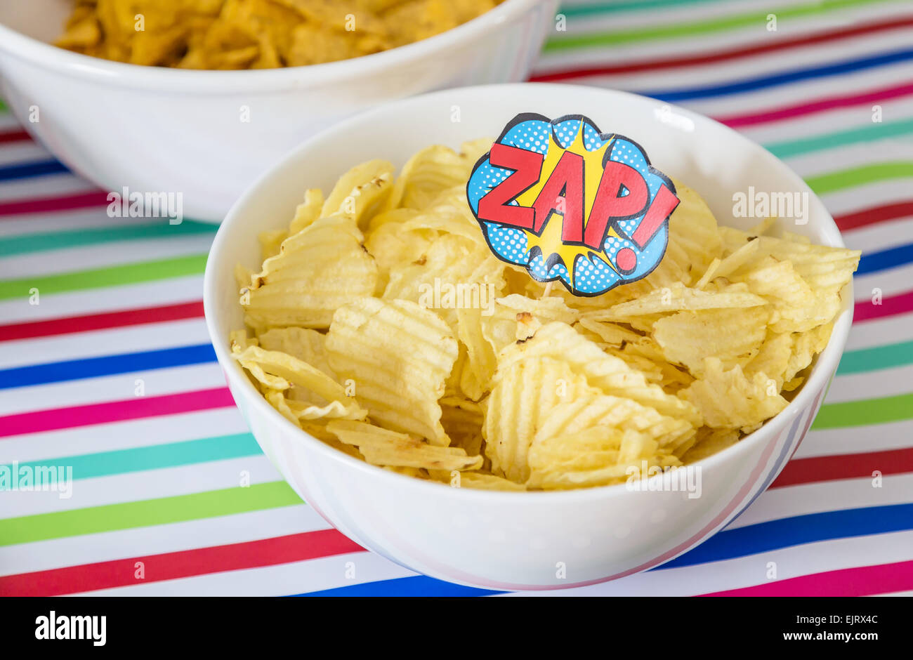 Child's birthday party bowl of chips with a superhero theme Stock Photo ...