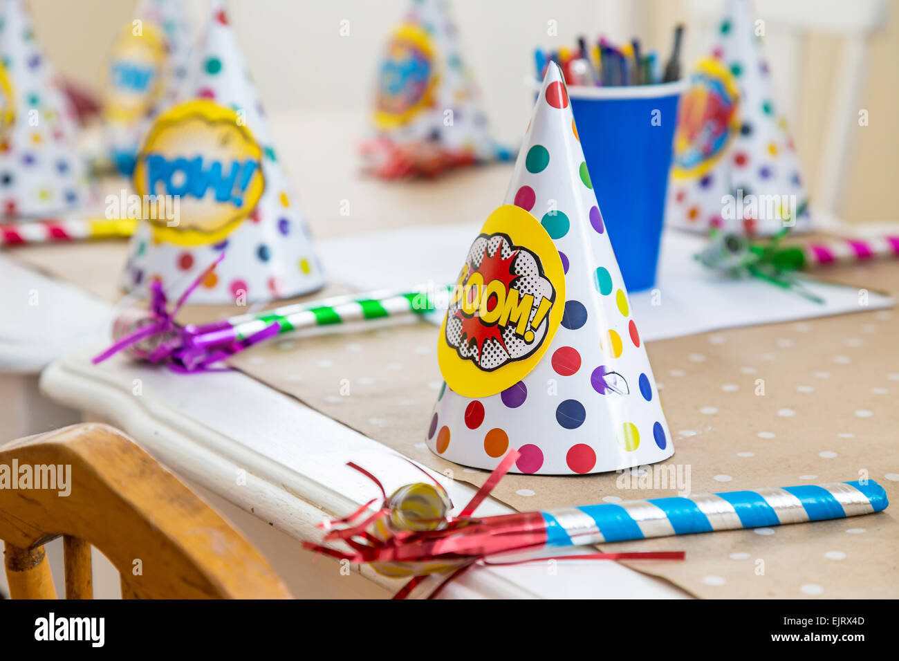 Child's birthday party hats with a superhero theme Stock Photo - Alamy