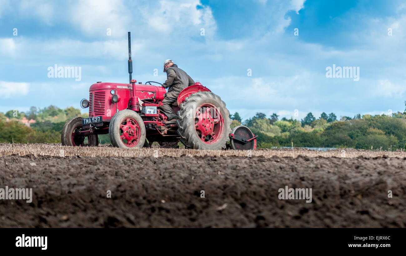 Old fashioned tractor ploughing field hi-res stock photography and ...
