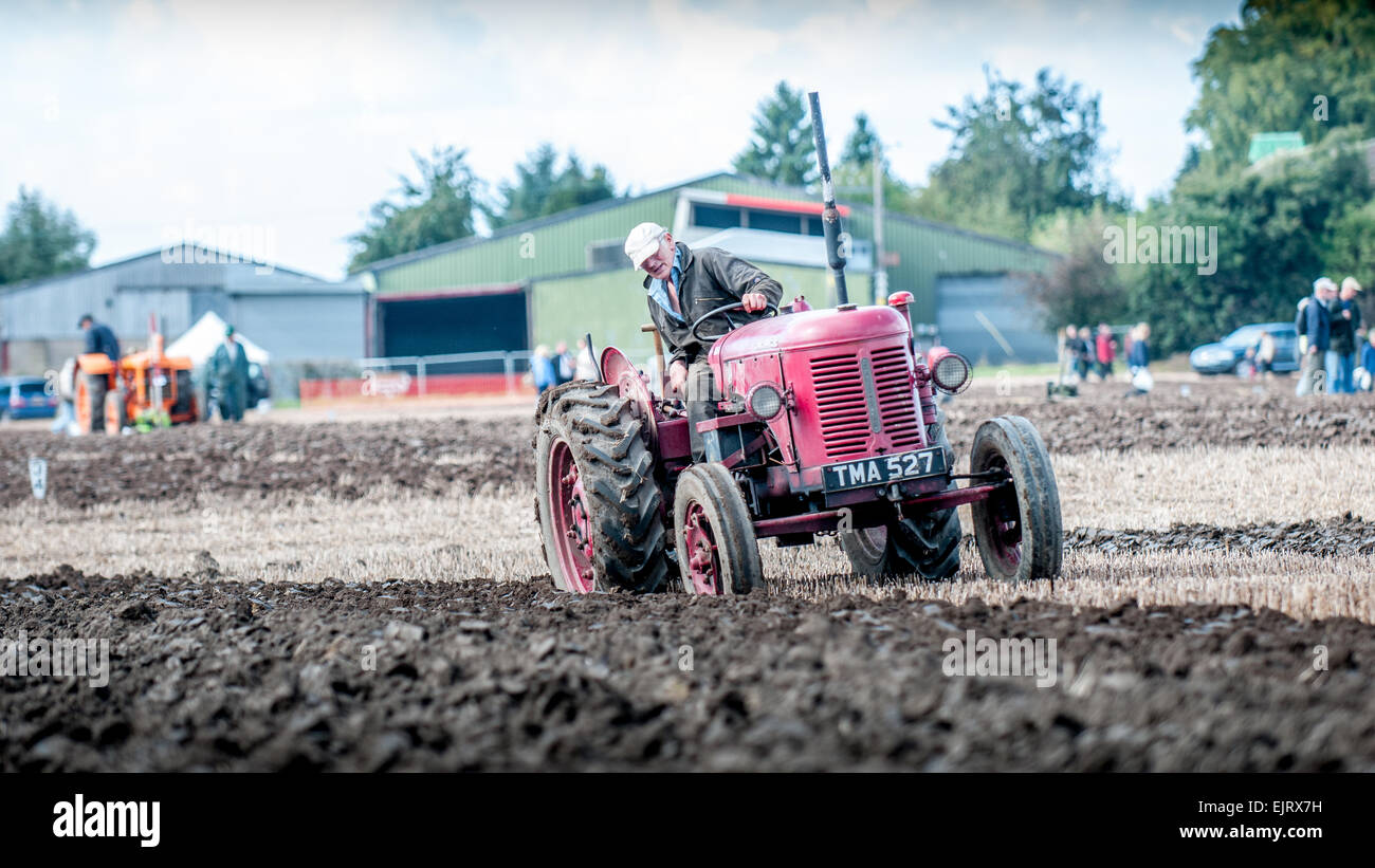 Old fashioned tractor ploughing field hi-res stock photography and ...