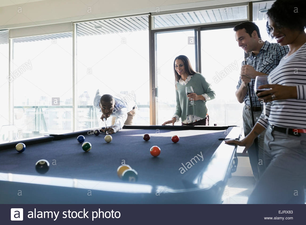 Couples playing pool Stock Photo - Alamy