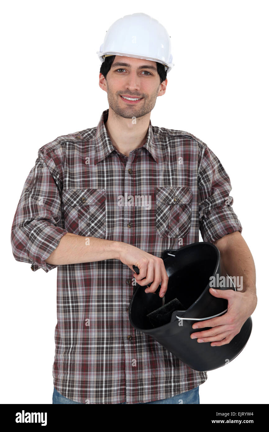 Construction worker with a bucket Stock Photo - Alamy