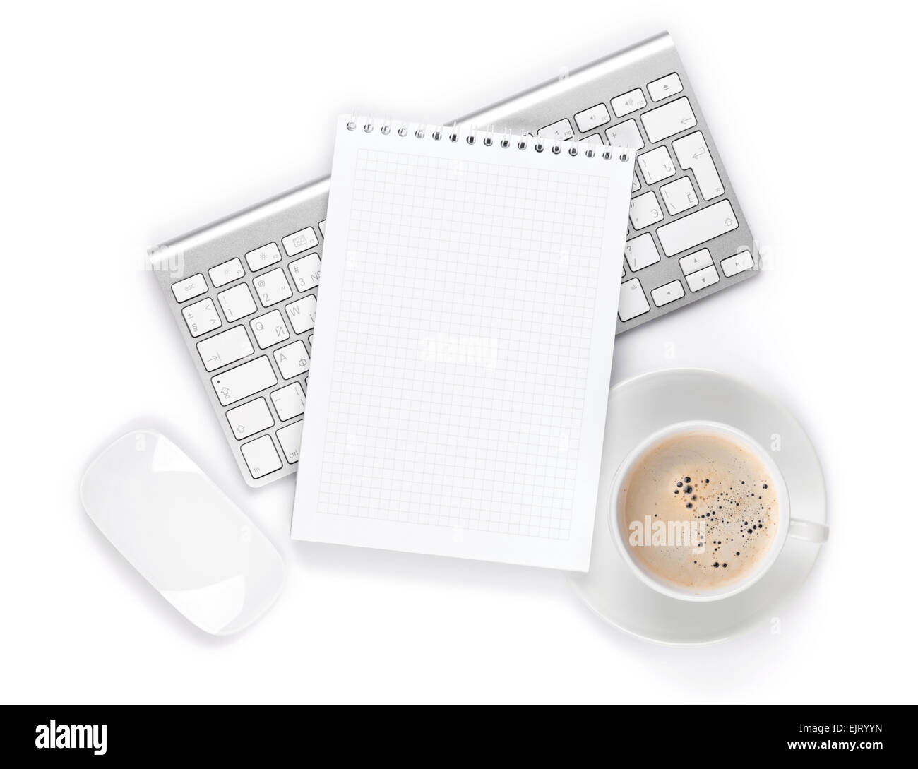 Office notepad over computer keyboard, mouse and coffee cup. Isolated ...