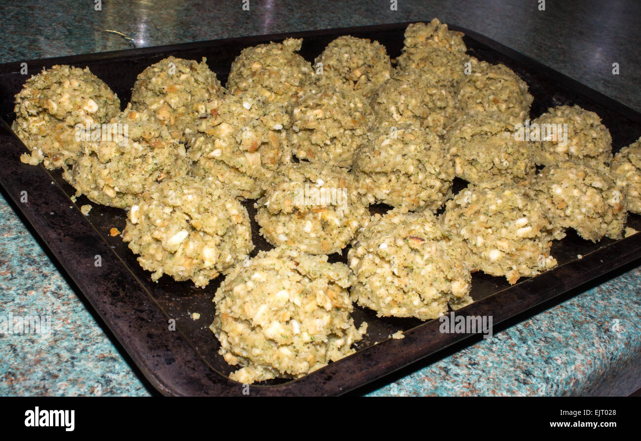 Perfectly round stuffing balls on a tray ready for cooking/baking for a ...