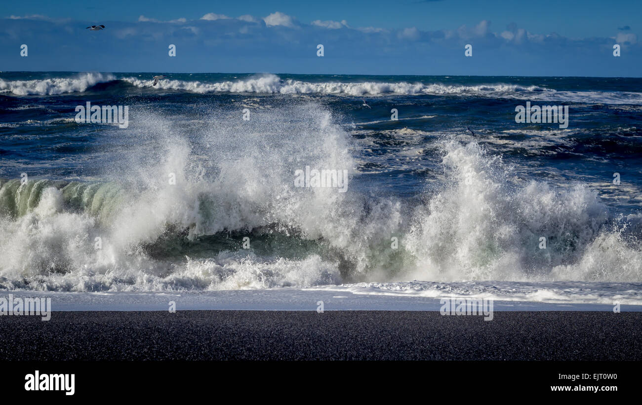 A huge wave crashes on the beach Stock Photo - Alamy