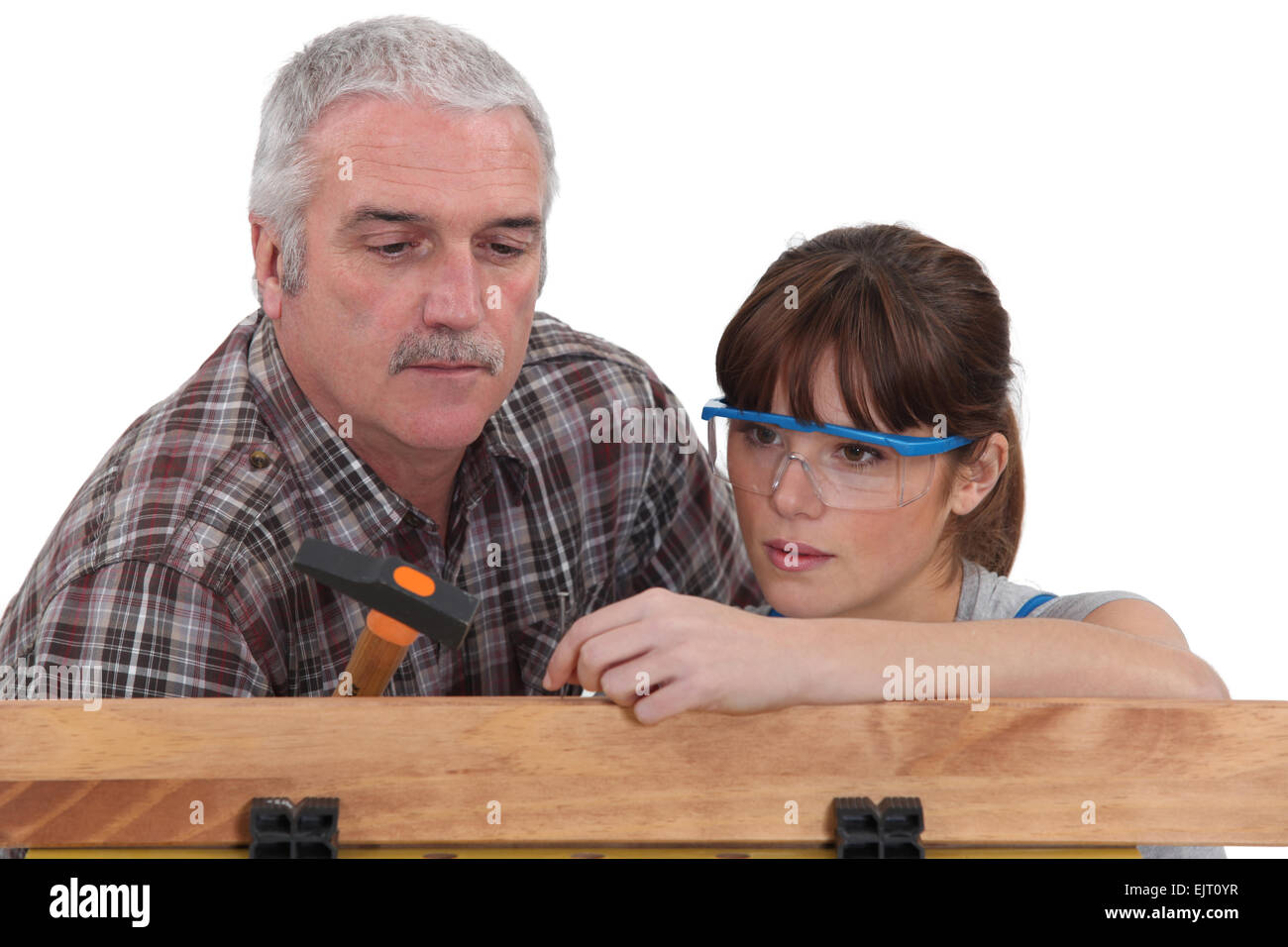 Builder and his apprentice Stock Photo - Alamy