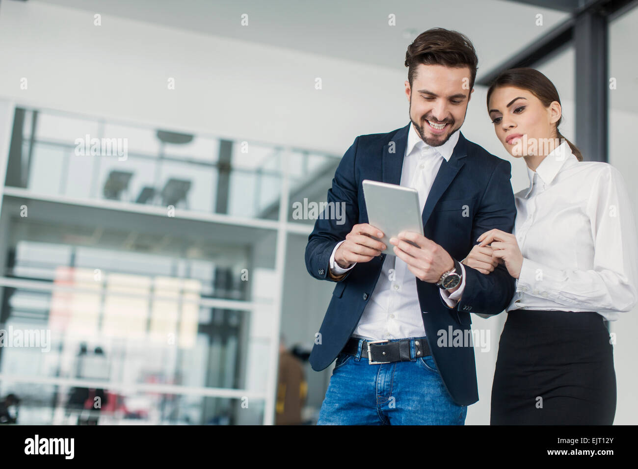 Young people with tablet in the office Stock Photo - Alamy