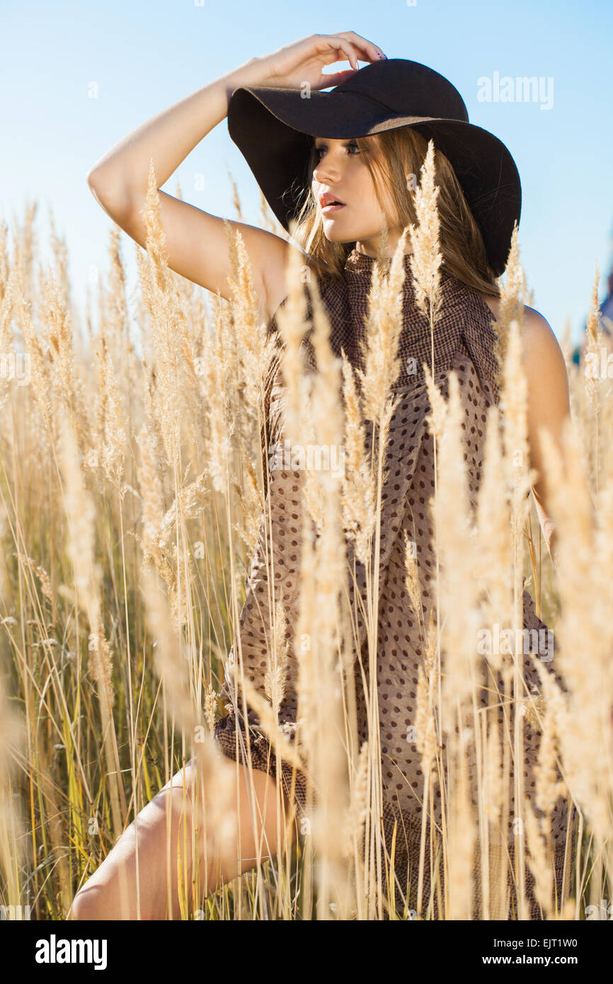 Beautiful model walking through meadow wilds Stock Photo - Alamy
