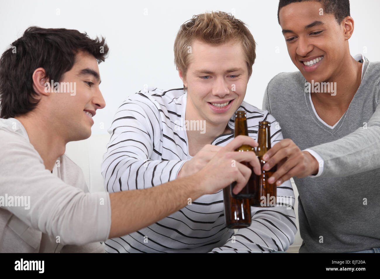 Three friends getting drunk together Stock Photo - Alamy