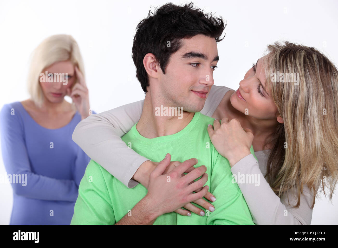 couple in love and jealous woman in background Stock Photo - Alamy