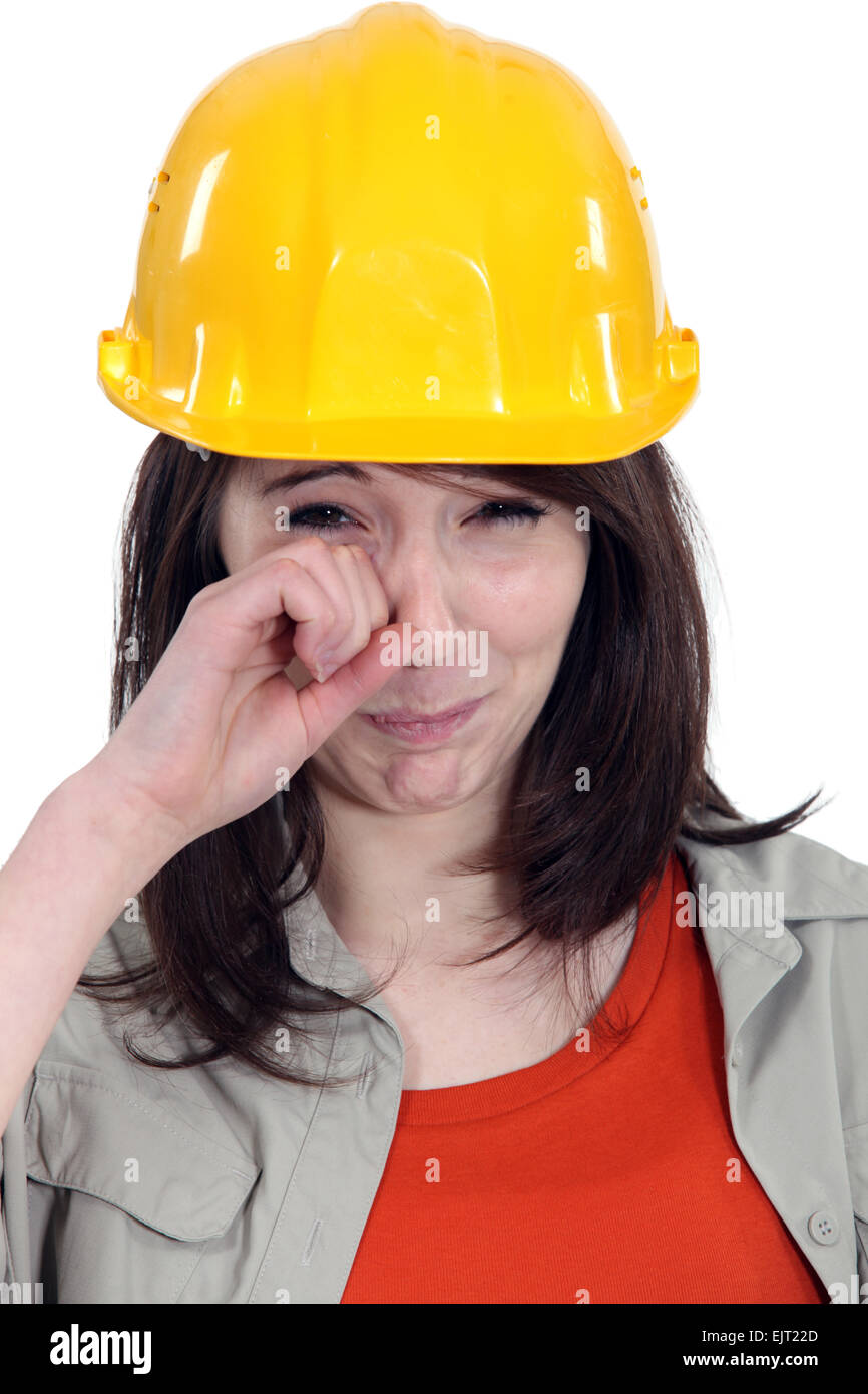 Brunette builder crying Stock Photo - Alamy