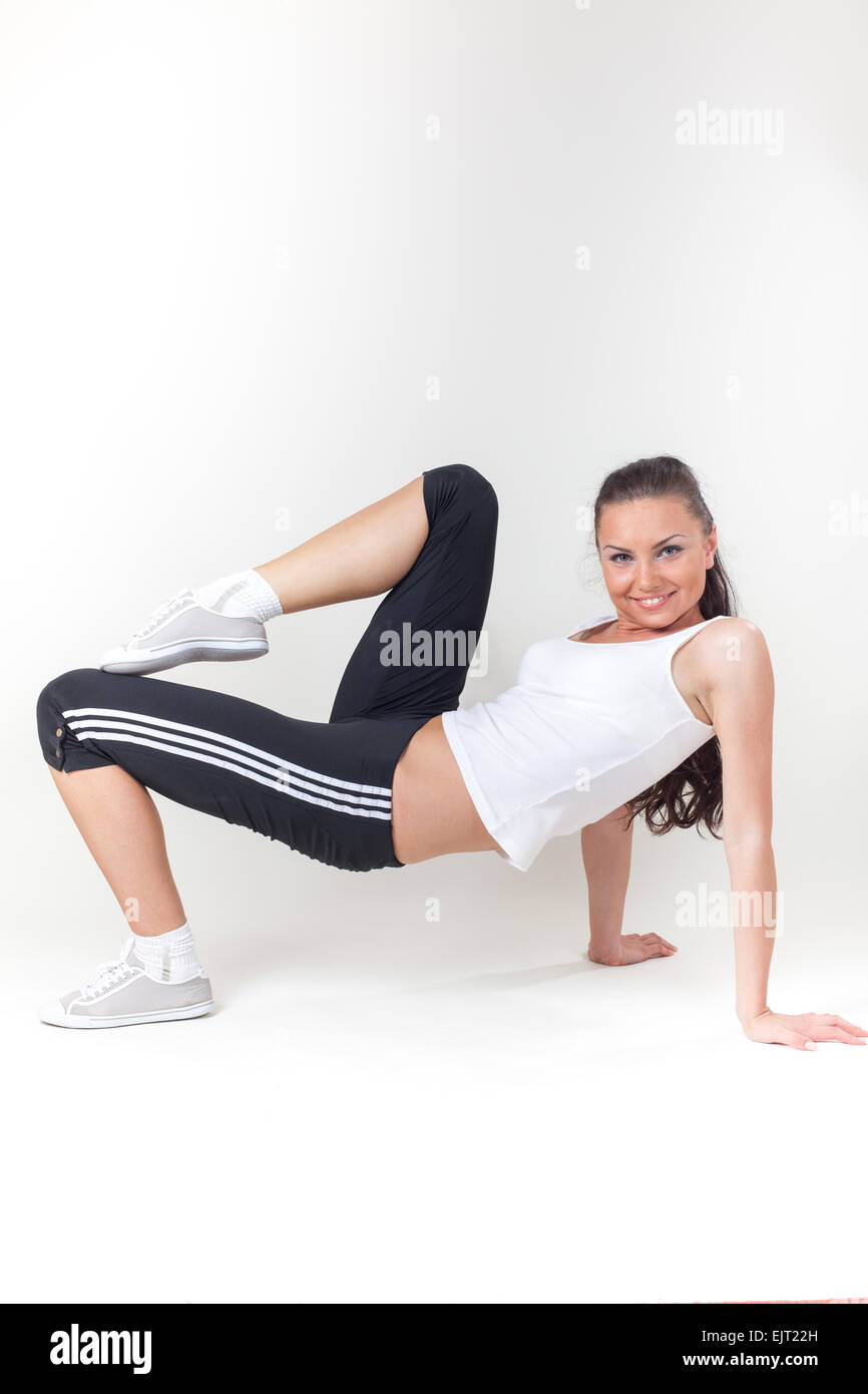 Fitness girl doing exercise. Portrait on the white background Stock ...