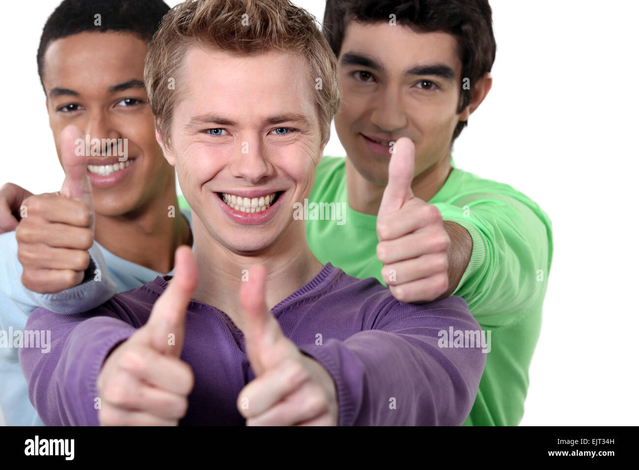 Three teenagers giving the thumbs-up Stock Photo - Alamy