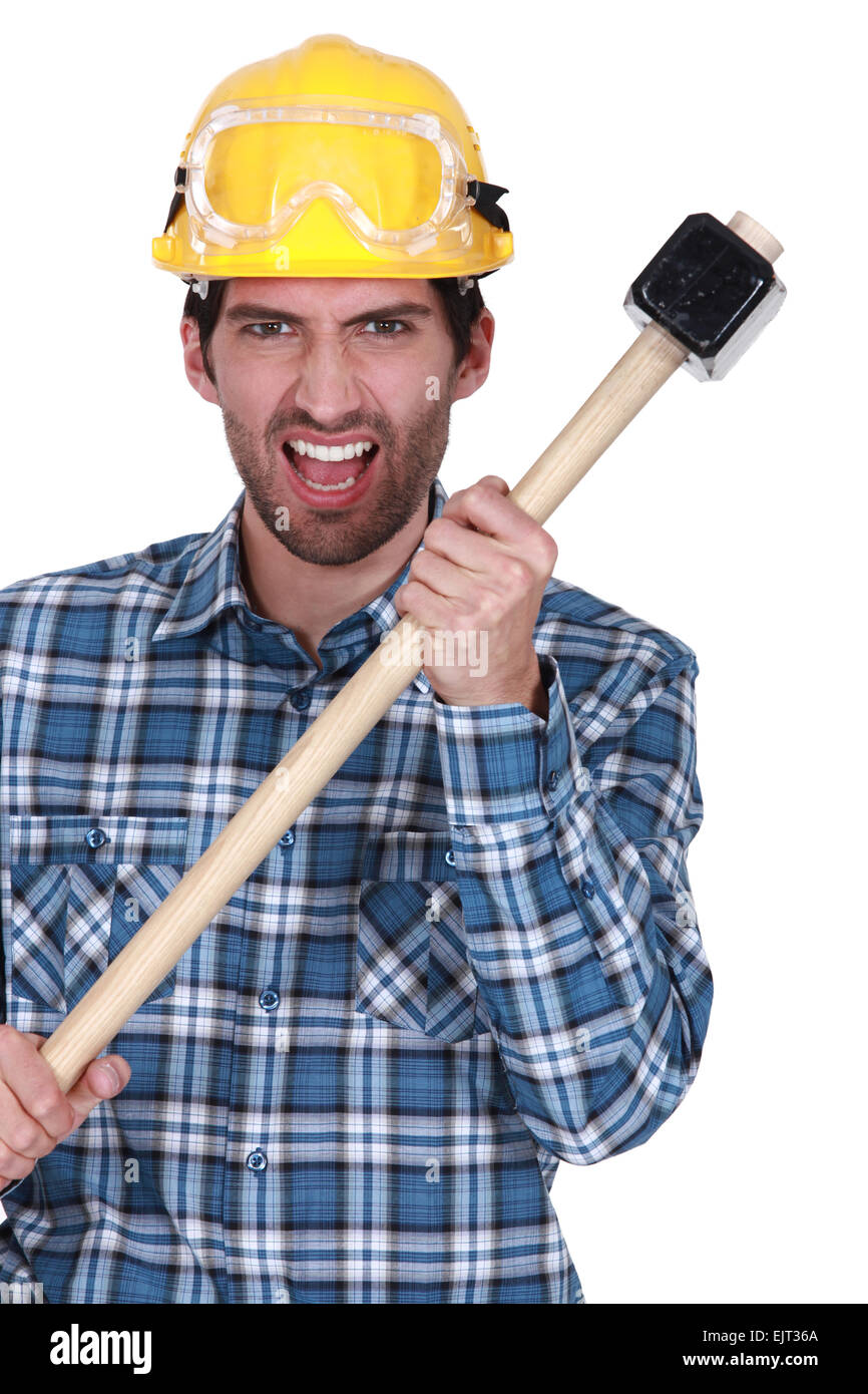 Angry construction worker with a sledgehammer Stock Photo - Alamy