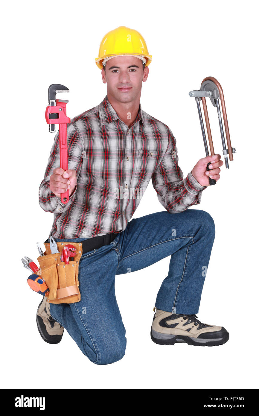 Plumber with tools Stock Photo - Alamy