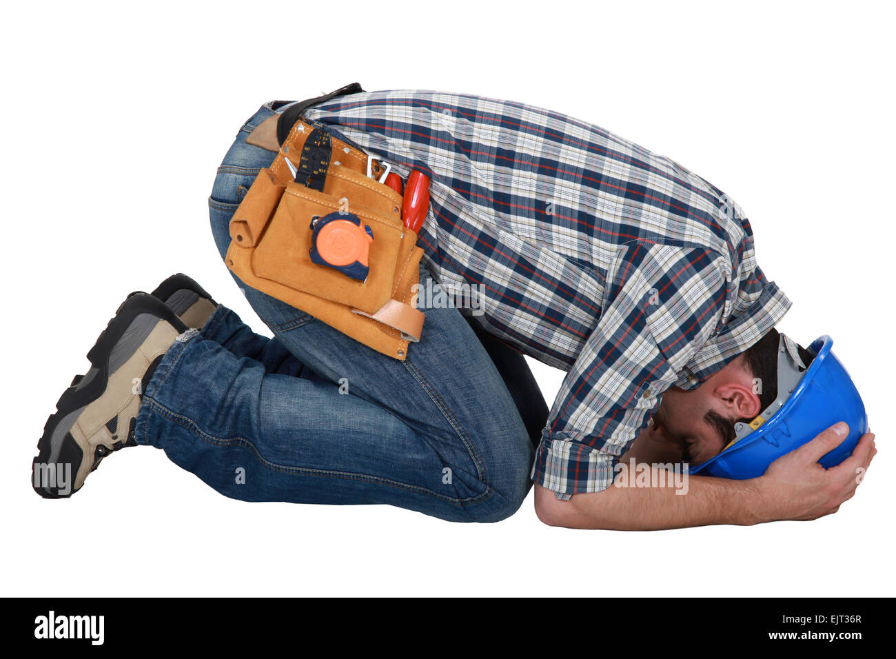 Construction worker curled up on the floor Stock Photo - Alamy