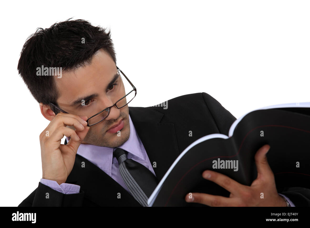 businessman reading a report Stock Photo - Alamy