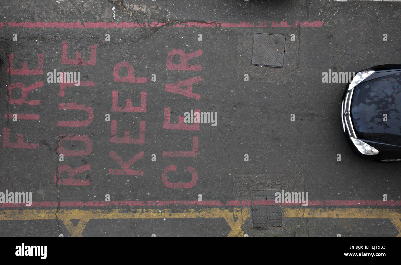 A car approaches a keep clear sign Stock Photo - Alamy