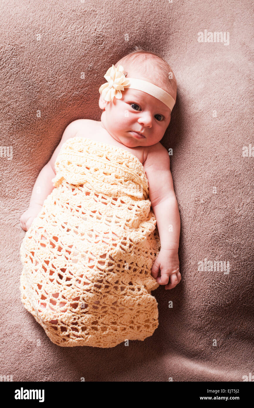 Baby girl covering face with hat hi-res stock photography and images ...