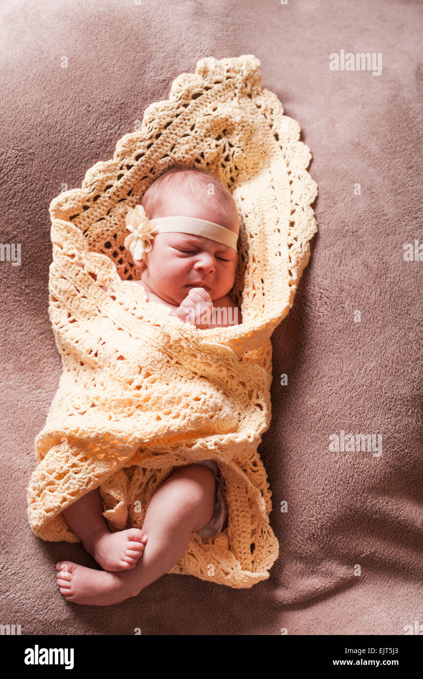 Baby girl covering face with hat hi-res stock photography and images ...
