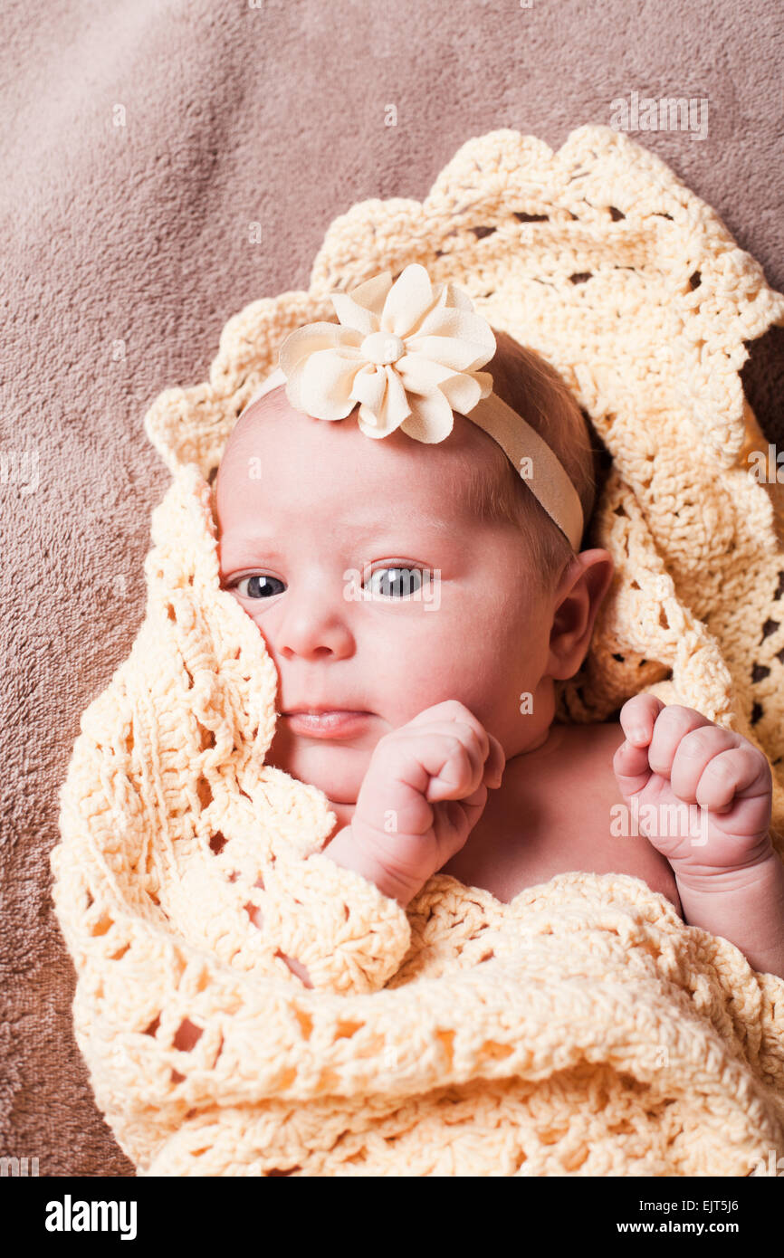 Baby girl covering face with hat hi-res stock photography and images ...