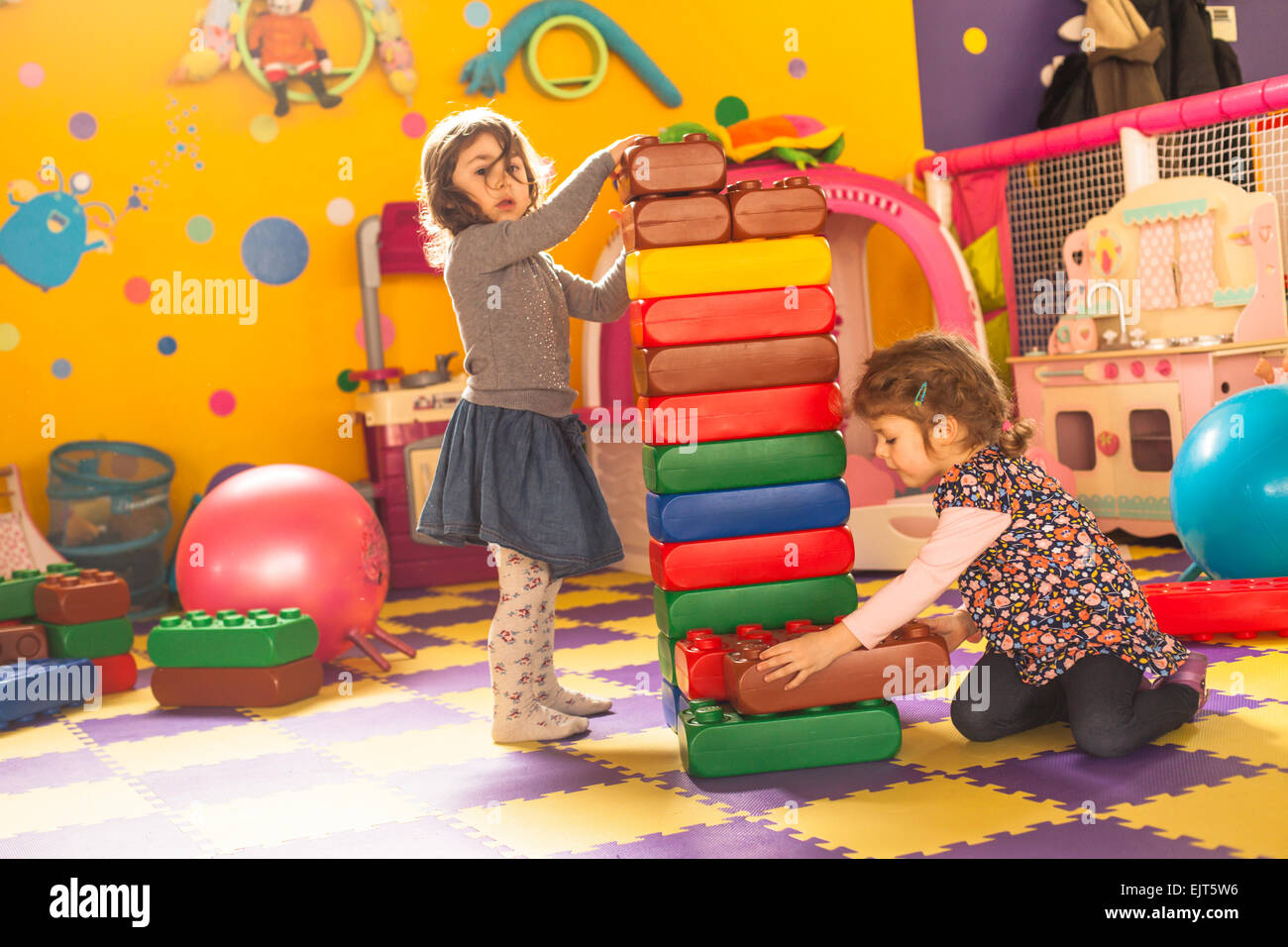 Two girls play Stock Photo - Alamy