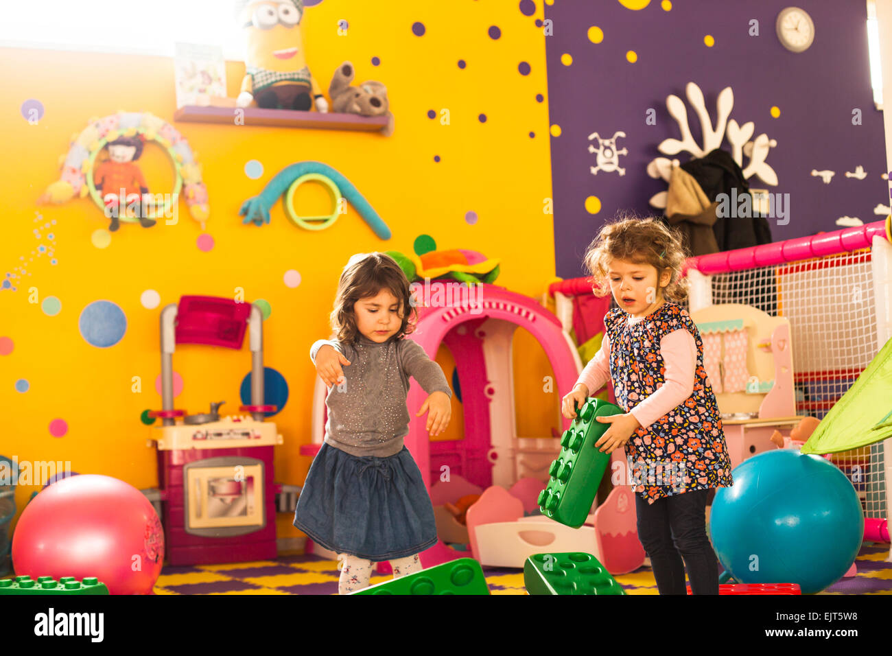 Two girls play Stock Photo - Alamy