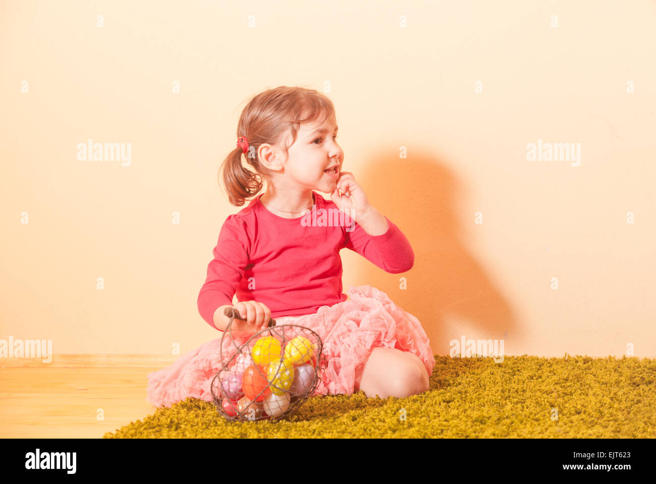 Girl on an Easter Egg hunt Stock Photo - Alamy