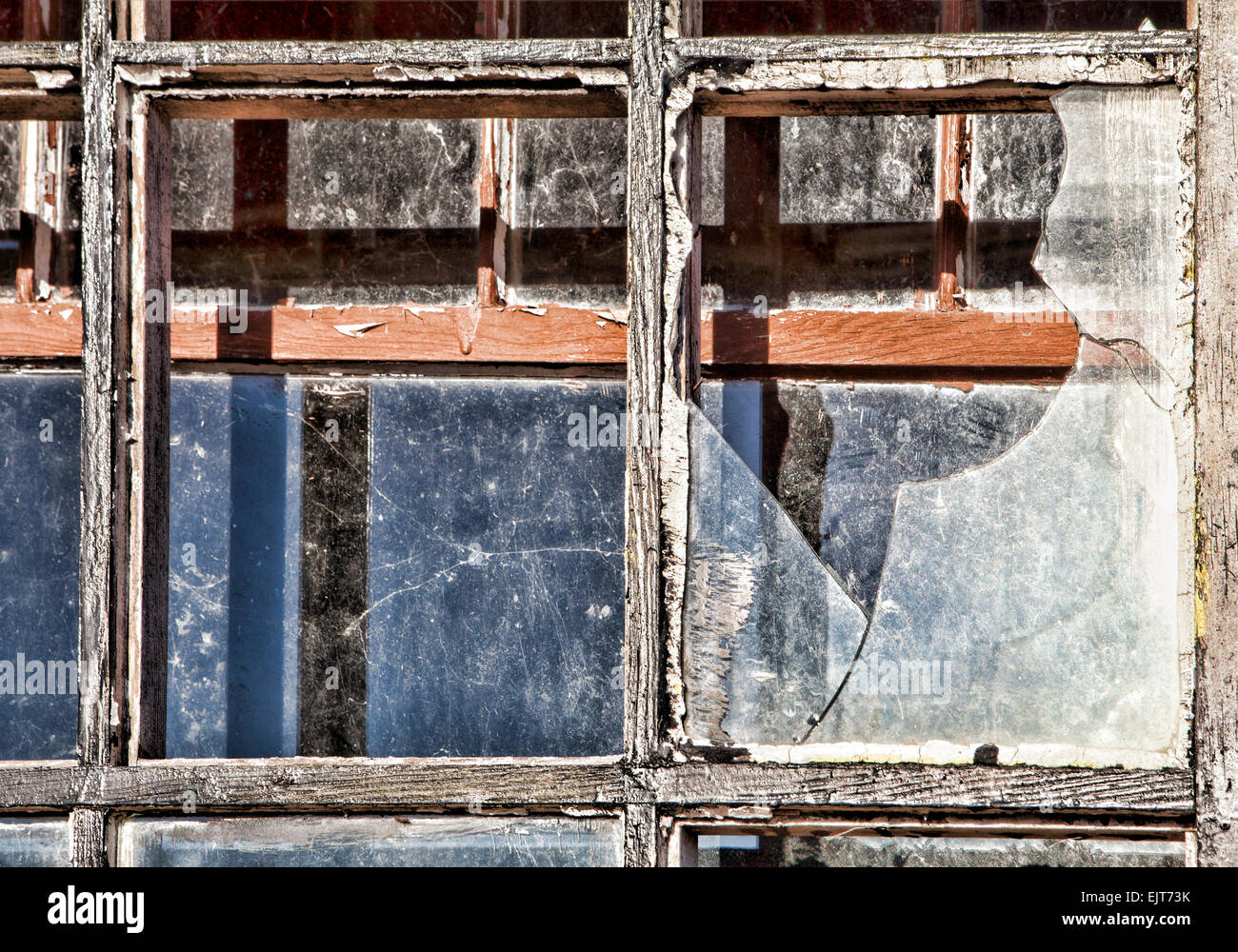 Old broken windows from an abandoned building in daylight Stock Photo ...