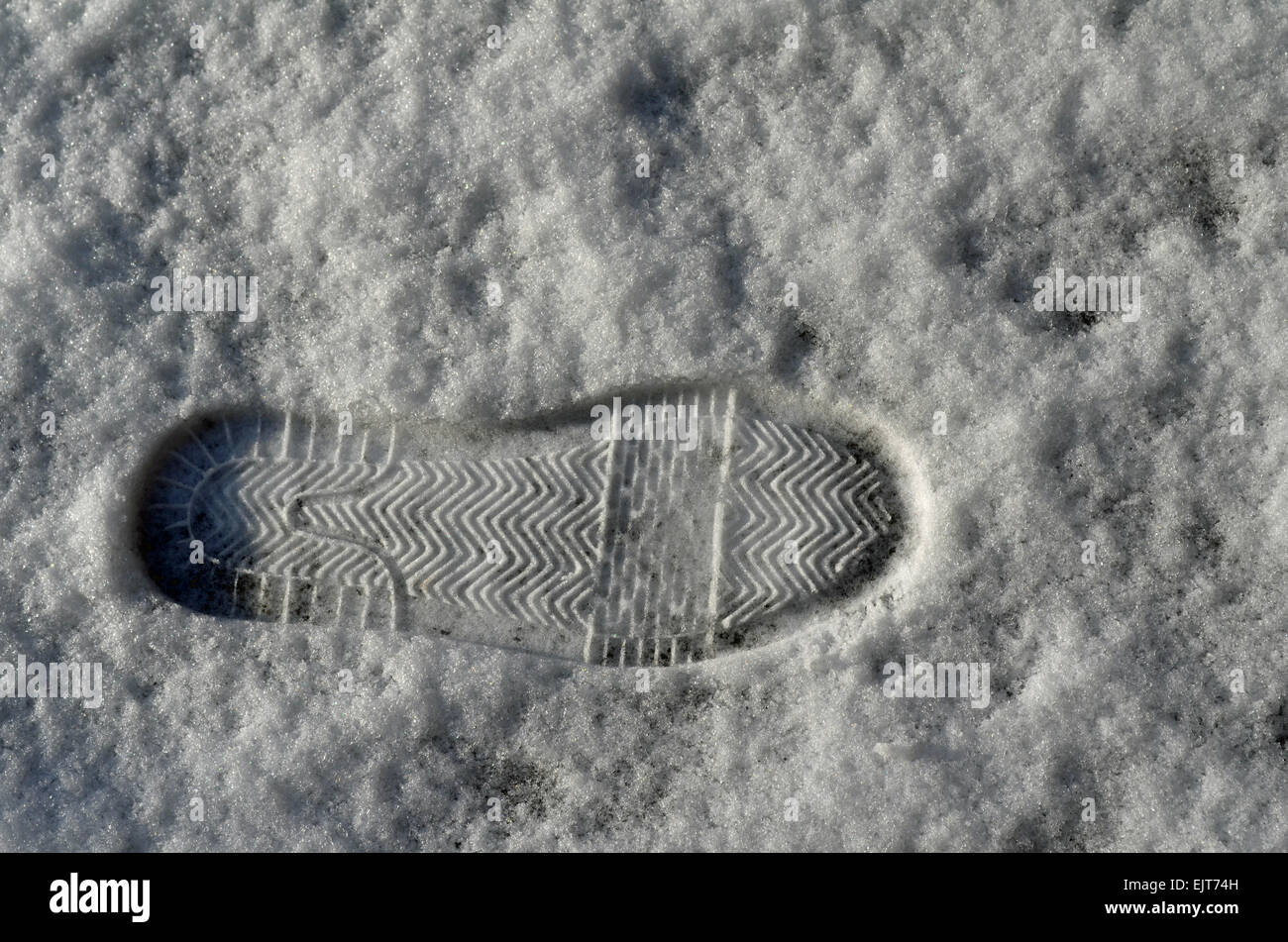 Footprint in the snow Stock Photo - Alamy