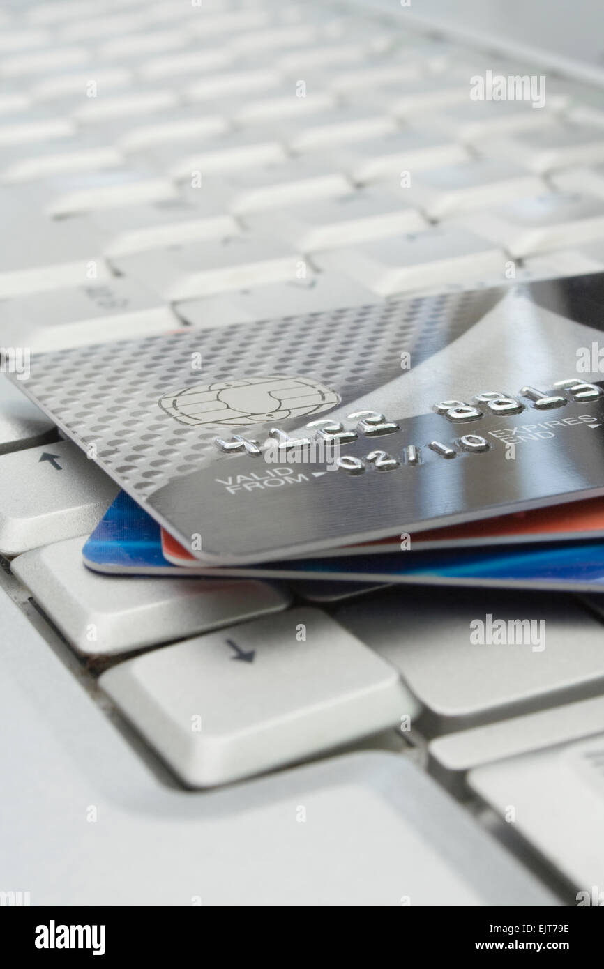 A Group off credit cards and bank cards on a laptop keyboard Stock ...