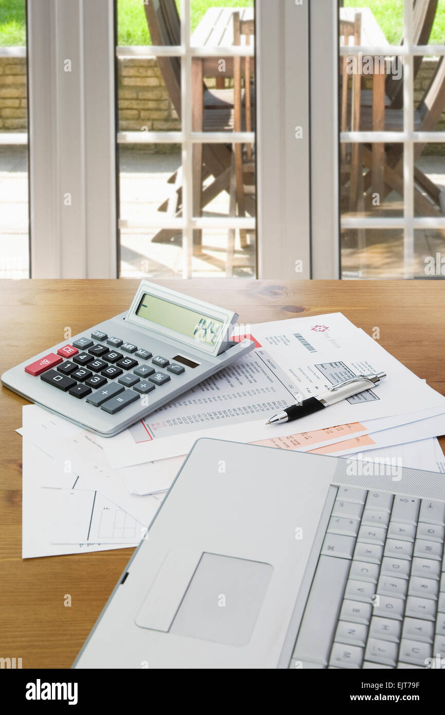 HouseHold Accounting using Calculator,Pen,lap Top and Bank statement ...