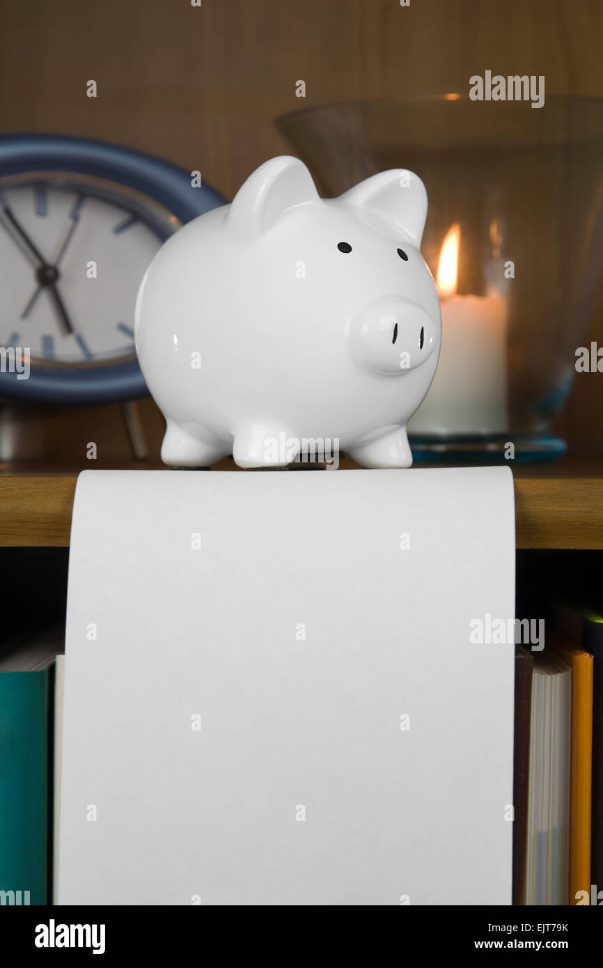 White Piggy Bank with white blank piece of paper too add your own text ...