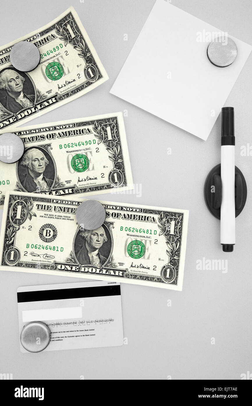 close up of a magnetic notice board with a credit card, three Dollar ...