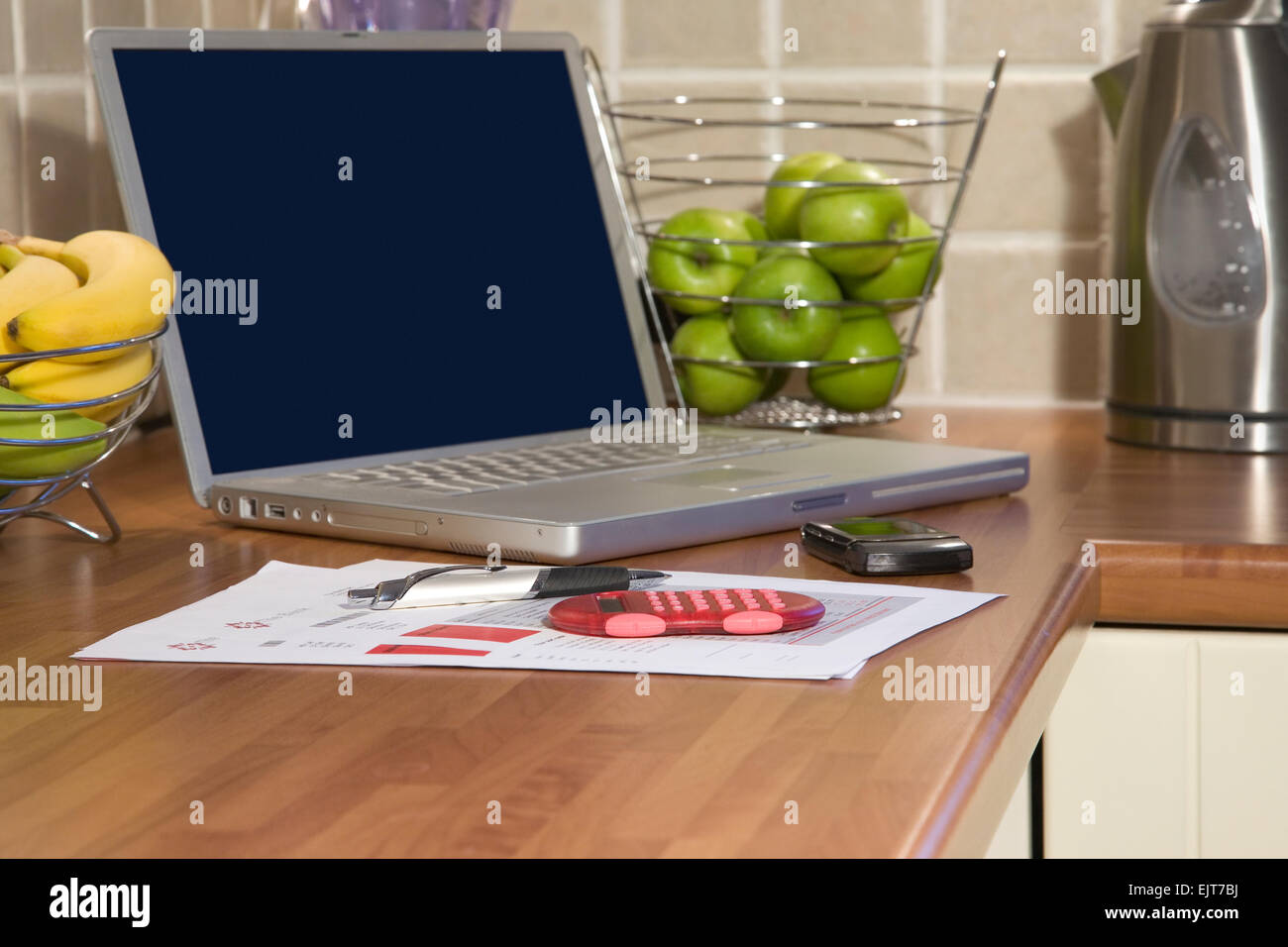 home finance and accounts using a bank statement,calculator and laptop ...