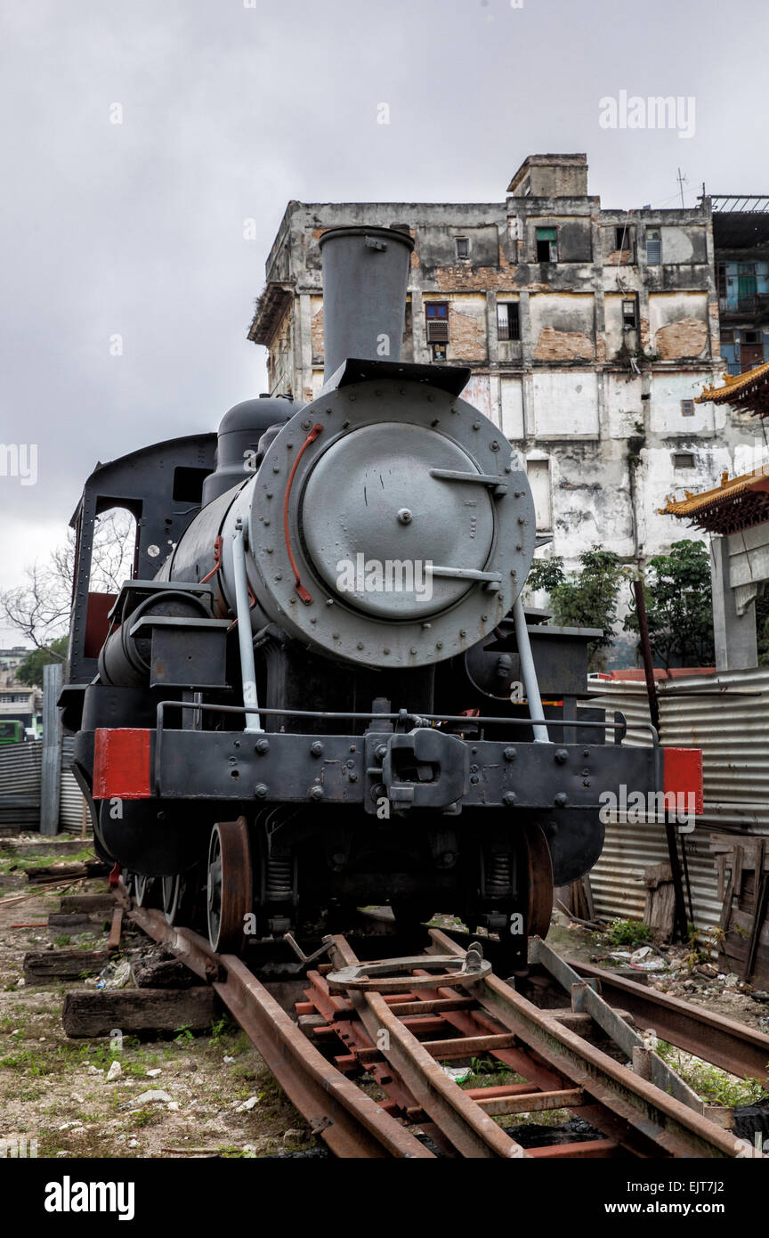 Old American steam engine in a rail yard in Havana being repaired and ...
