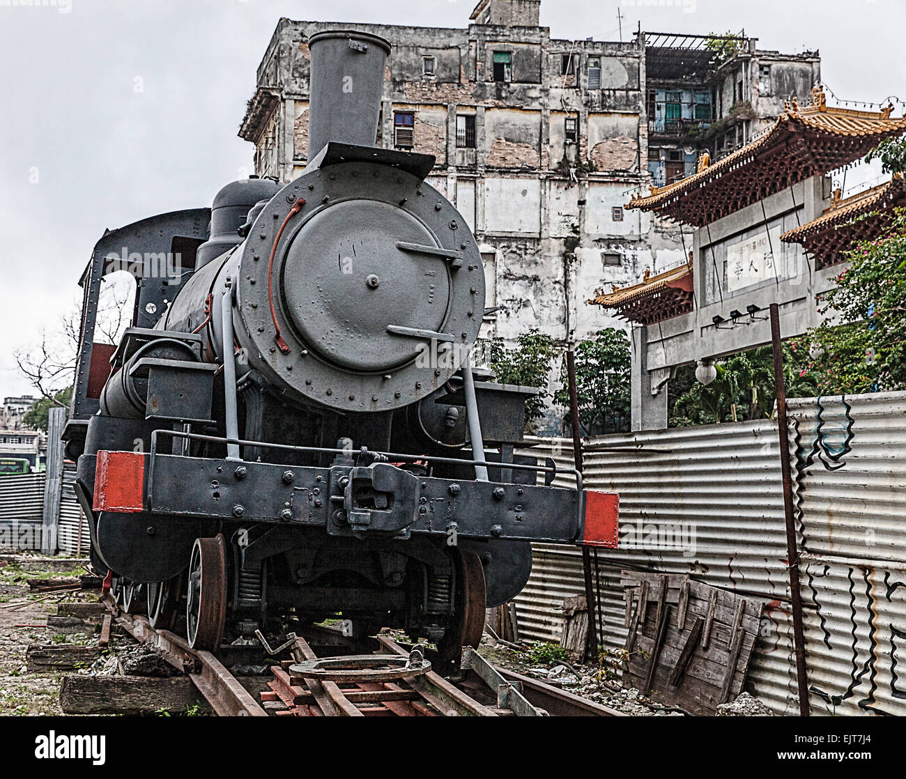 Old Grey American steam train in a railway yard being repaired in Old ...