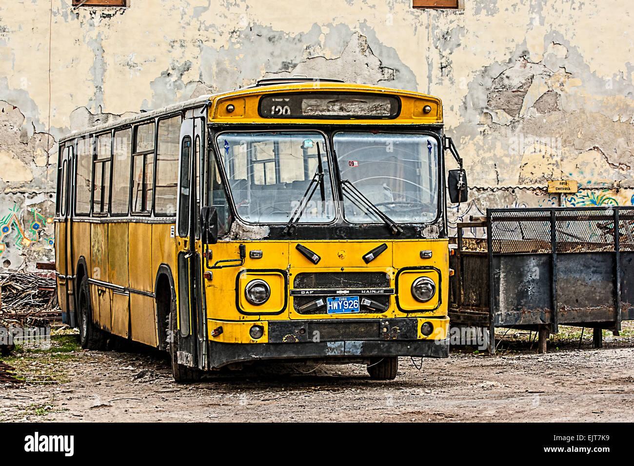 Old American yellow school bus in need of repair in a railway repair ...