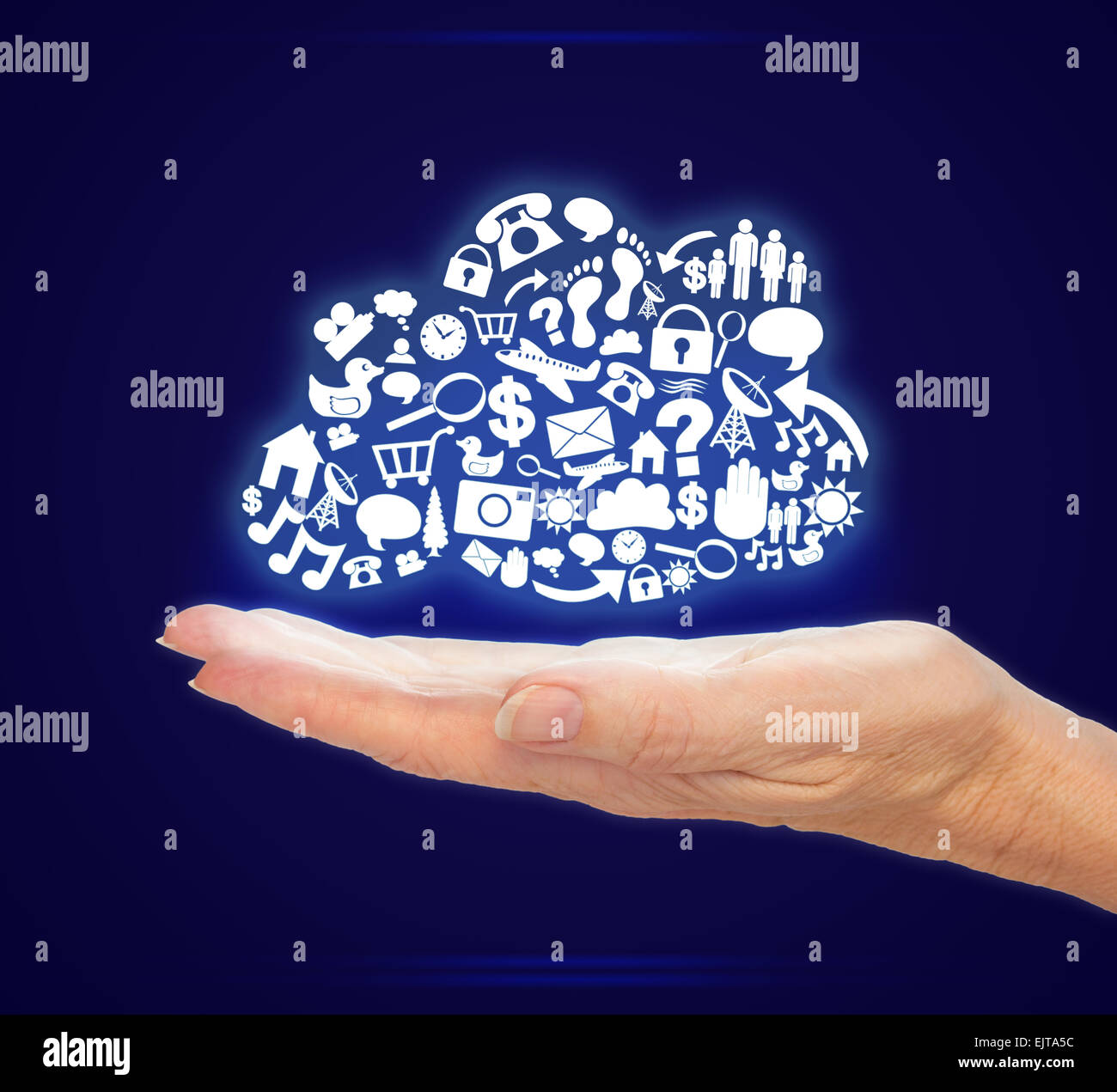 Hand Holding Computer Icons in Cloud Shape on Blue Background Stock ...