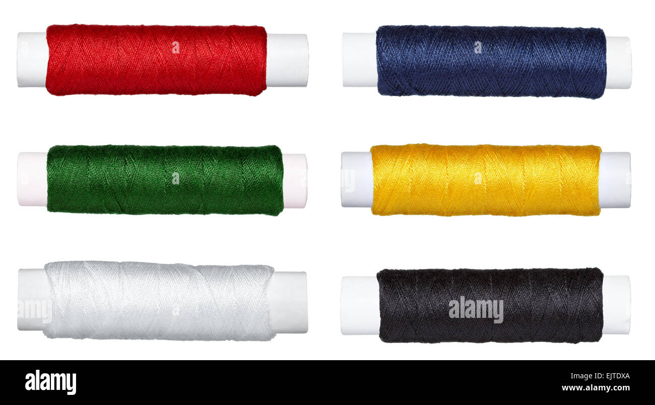 collection of various sewing threads on on white background. each one ...